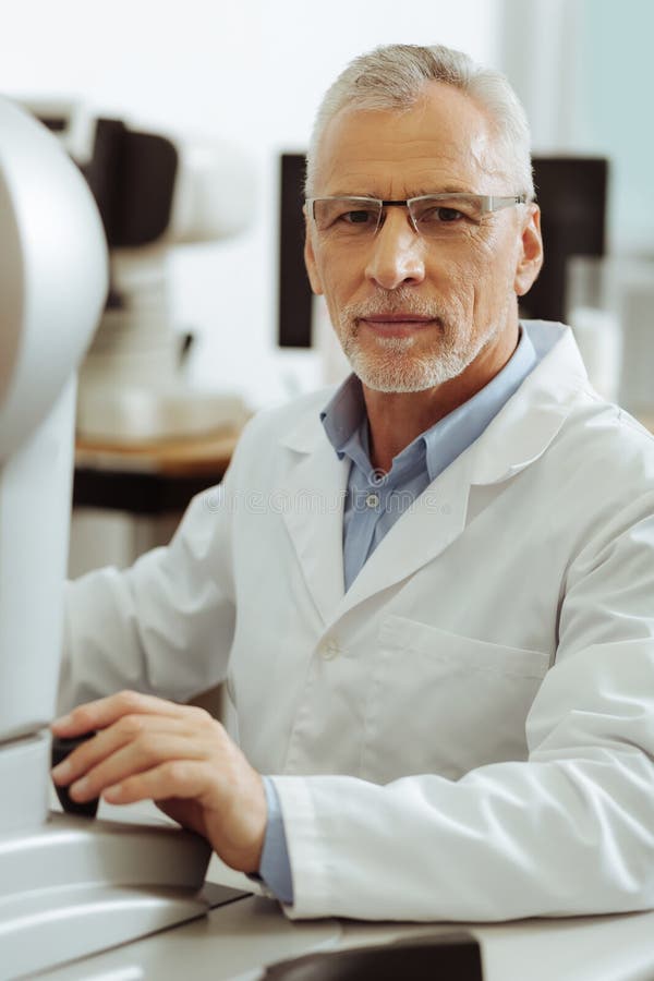 Professional Experienced Eye Doctor Sitting at the Table Stock Photo ...