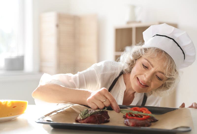 Professional Female Chef Preparing Meat on Table Stock Photo - Image of ...