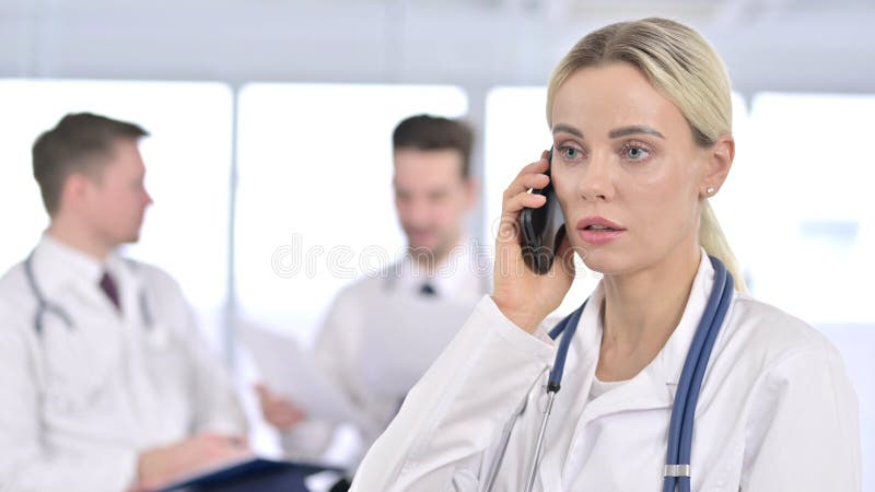 Professional Female Doctor Talking on Smartphone Stock Photo - Image of ...
