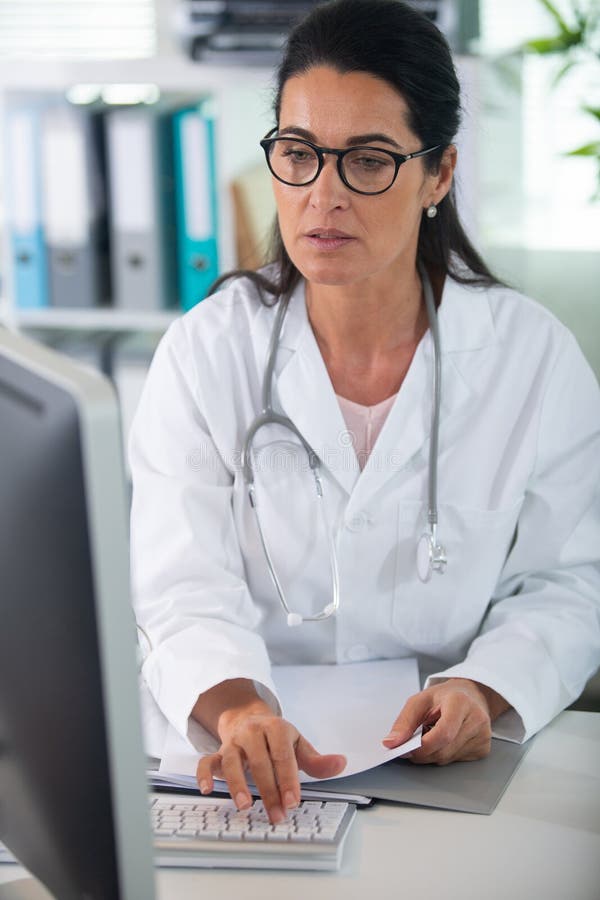 Professional Female Doctor Using Computer Stock Image - Image of female ...