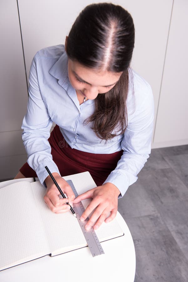 Professional Female is Drawing in a Notebook with Ruler and Penc Stock ...