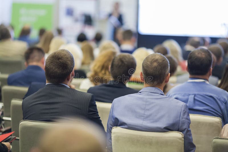 Professional Female Host Speaking in Front of the Large Audience during ...