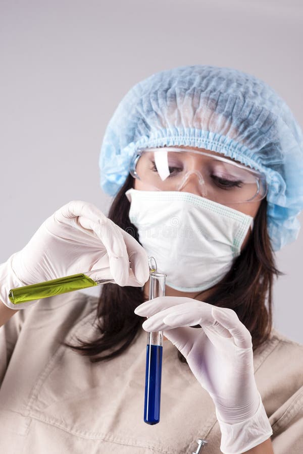 Professional Female Laboratory Staff Making a Solution Using Glass ...