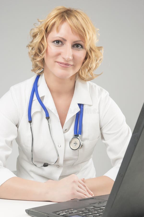 Professional Female Medic Staff with Laptop Stock Photo - Image of ...