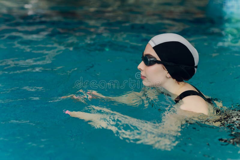 Professional Female Swimmer Training in a Swimming Pool. Stock Photo ...