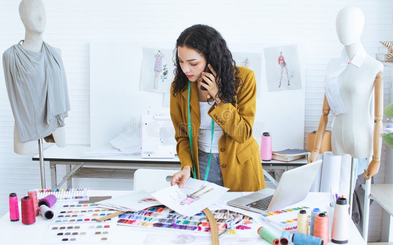 Professional Female Tailor Wearing Modern Suit, Working, Using Mobile ...