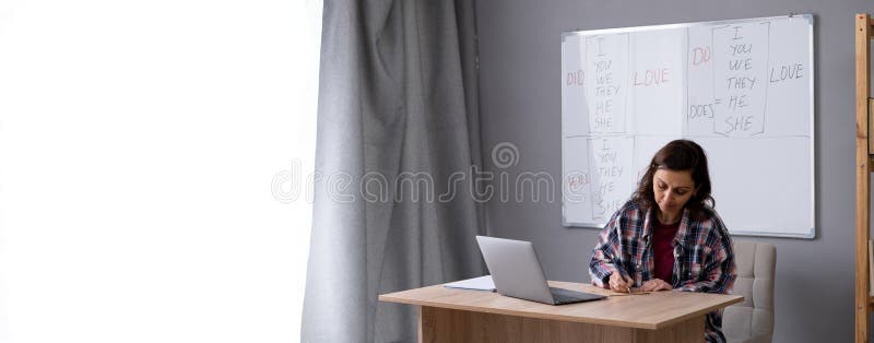 Professional Female Teacher Having Online Call with Students Using ...