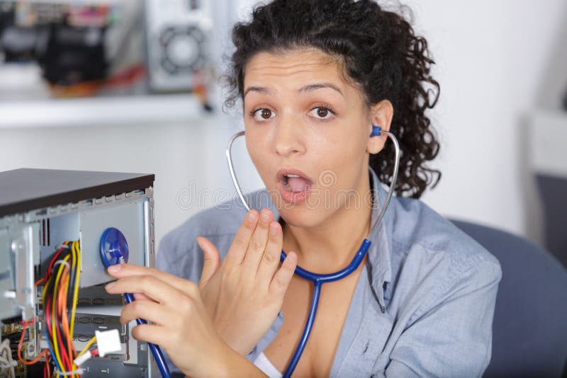 Professional Female Technician Repairing Computer in Workshop Stock ...