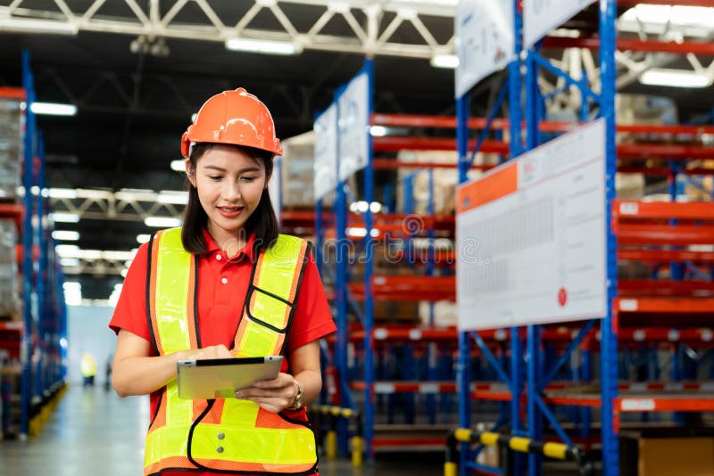 Professional Female Worker Wearing Hard Hat Uses Digital Tablet ...