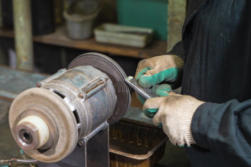 Professional Fitter Man Using Paste for Metal Polishing Machine Circle ...