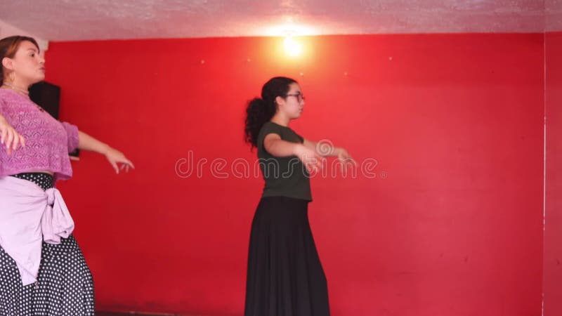Professional Flamenco Dancer Instructs a Young Woman in Flamenco Dance ...