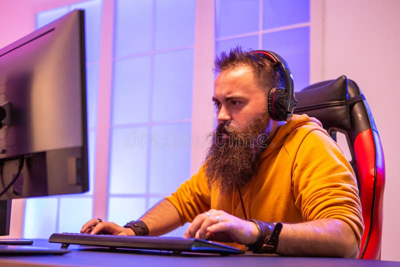 Professional Gamer with Long Beard in Front of Powerful Gaming Rig ...