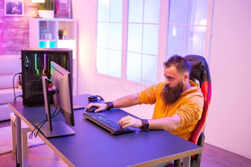 Professional Gamer with Long Beard in Front of Powerful Gaming Rig ...