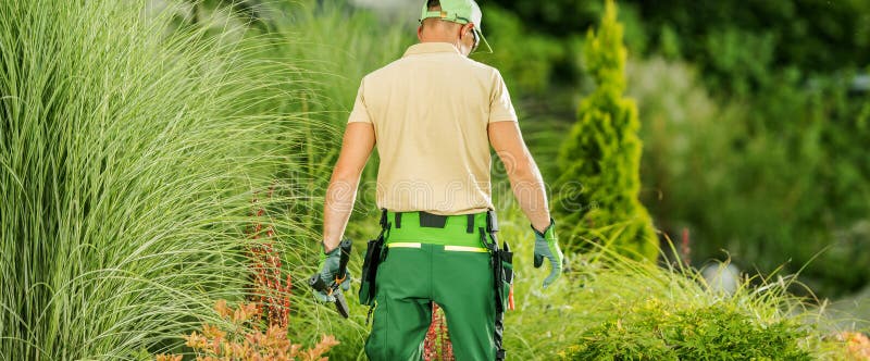 Professional Garden Keeper in Front of Beautiful Garden Stock Image - Image of outdoor, gardener ...