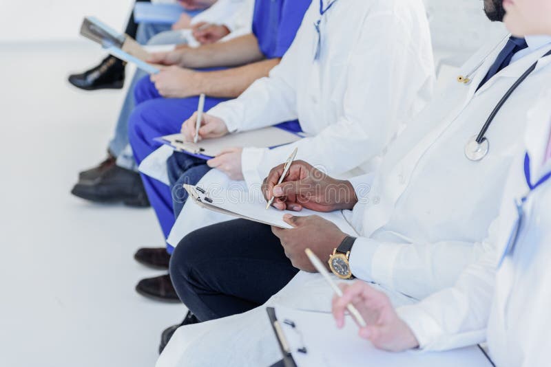 Professional General Practitioners Making Notes at Clinic Stock Image ...