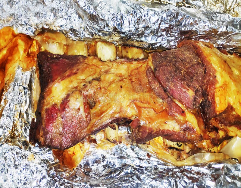 Professional Grilled Fried Leg of Lamb is Lying on Foil. Stock Photo ...