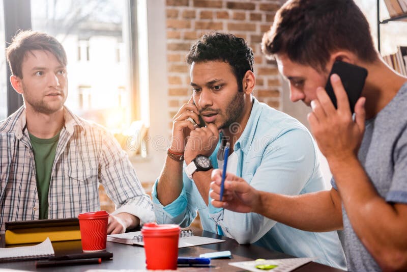 Professional Group Sitting at Table and Working on New Business Project ...