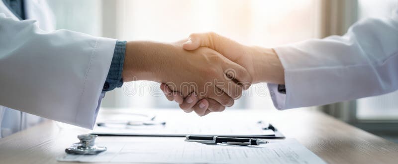 The Professional Handshake between Two Doctors in a Medical ...