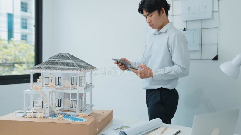 Professional Project Manager Using Tablet To Check House Model ...