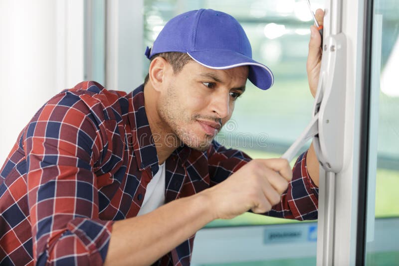 Professional Handyman Fixing Window Handle at Home Stock Image - Image ...
