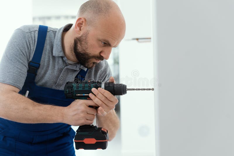 Professional Handyman Using a Drill Stock Photo - Image of drill ...
