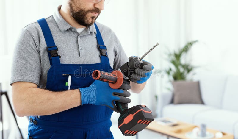 Professional Handyman Using a Drill Stock Image - Image of repairman ...