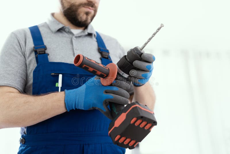Professional Handyman Using a Drill Stock Photo - Image of domestic ...