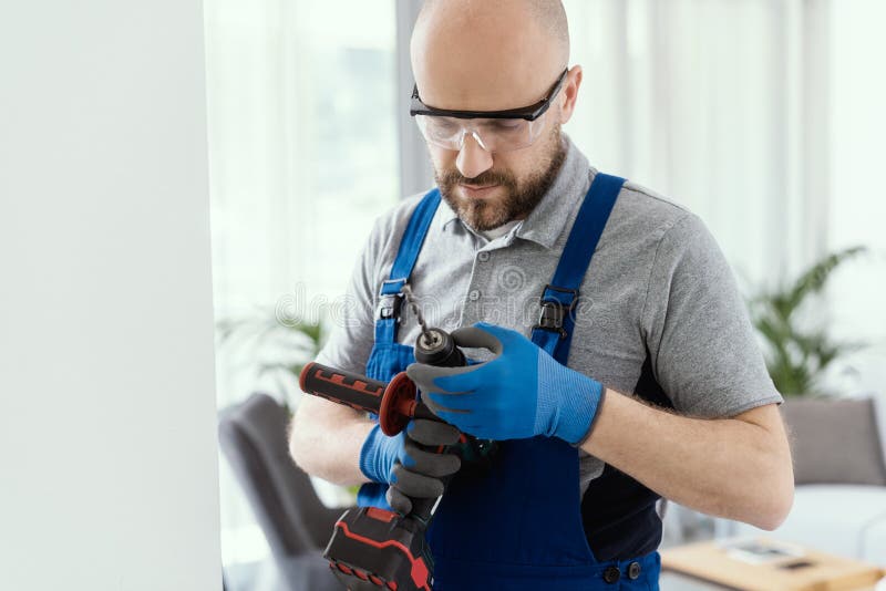 Professional Handyman Using a Drill Stock Photo - Image of residential ...