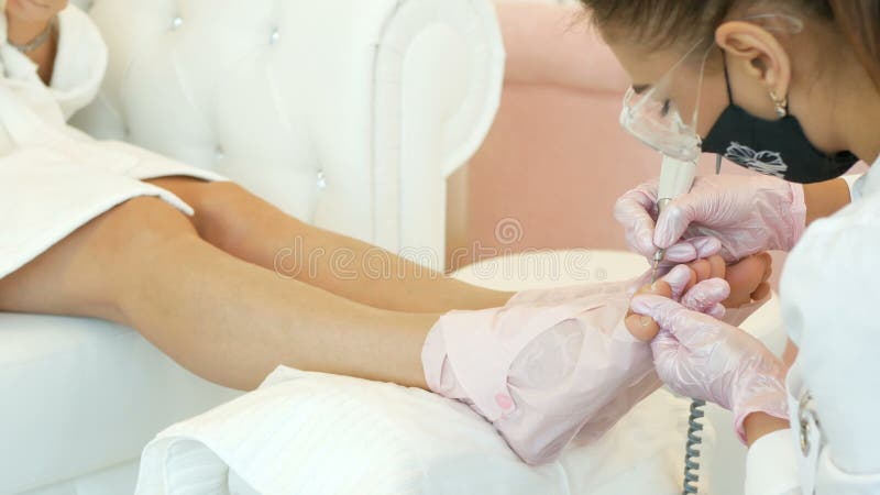 Professional Hardware Pedicure Using an Electric Machine. Patient at a ...