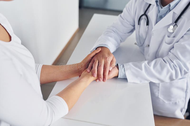 Professional Help. Medic in White Coat is in the Clinic Stock Image ...