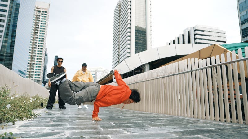 Professional Hipster Doing Head Spin while Friend Cheering Him ...