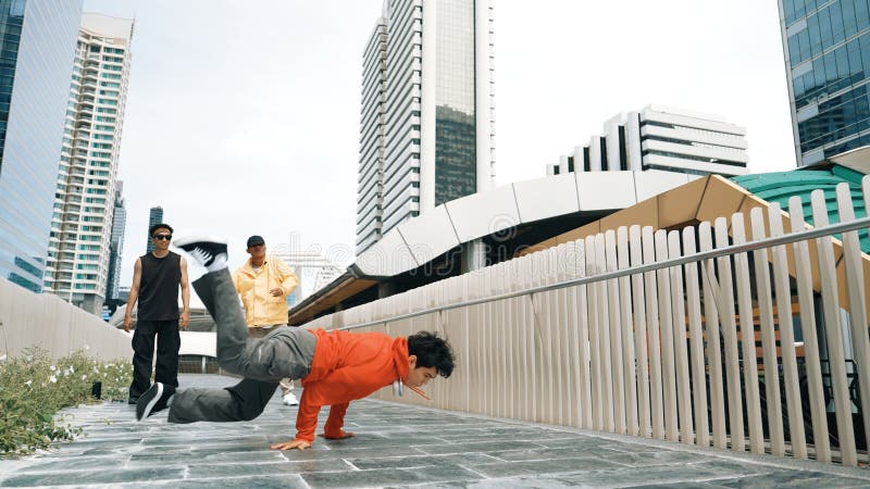 Professional Hipster Doing Head Spin while Friend Cheering Him ...