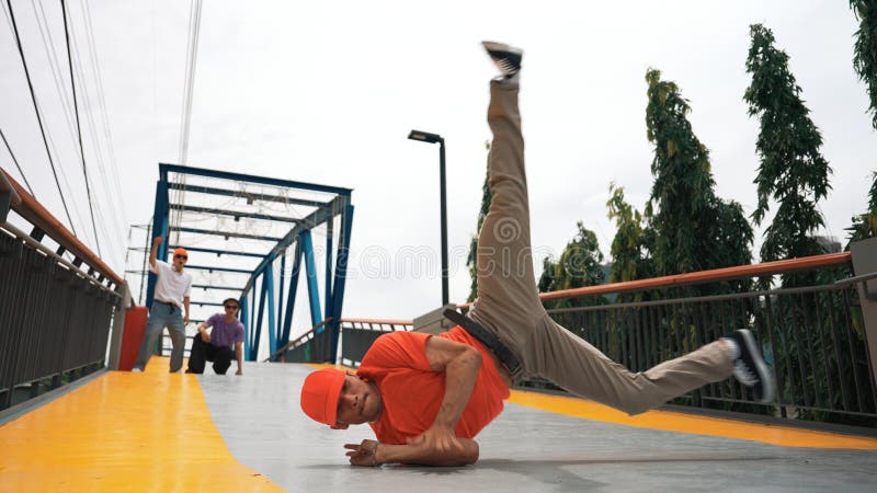 Professional Hipster Doing Head Spin while Friend Cheering Him ...