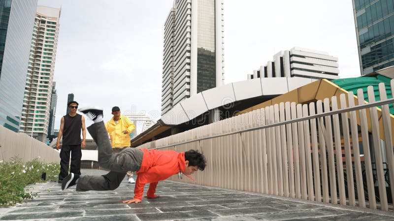 Professional Hipster Doing Head Spin while Friend Cheering Him ...