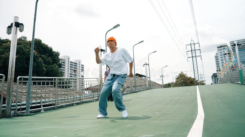 Professional Asian Hipster Walking while Doing Freeze Pose at Bridge ...