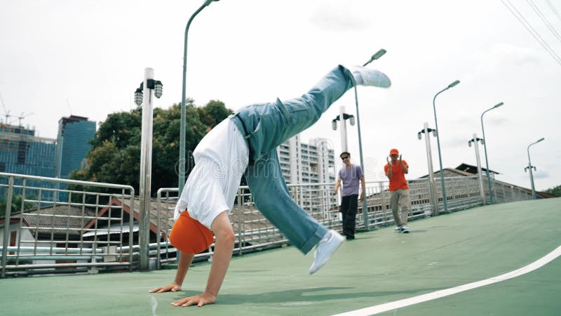 Professional Hipster Walking while Doing Freeze Pose at Bridge ...