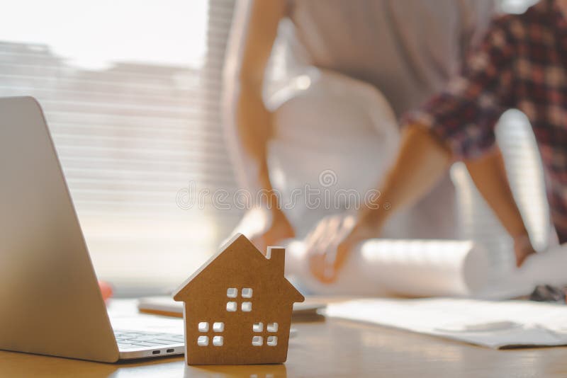 Professional Home Builder Concept. Architects Planning on the Blueprint ...