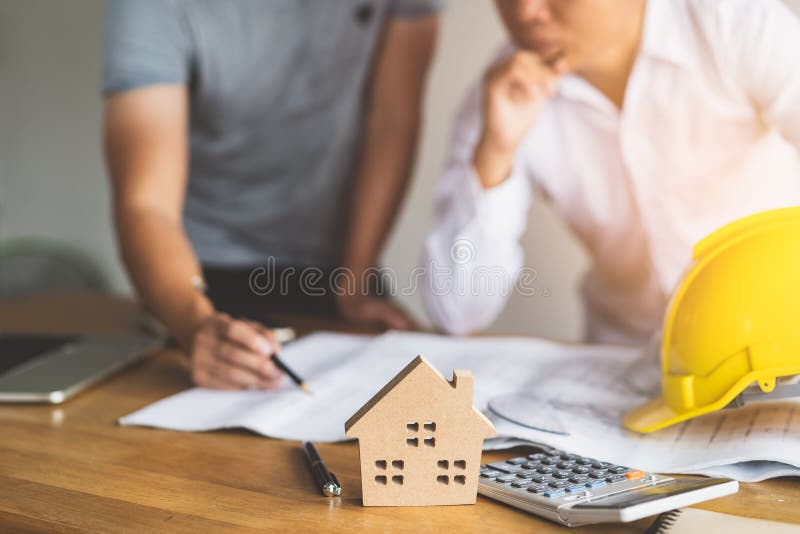 Professional Home Builder Concept. Architects Planning on the Blueprint ...