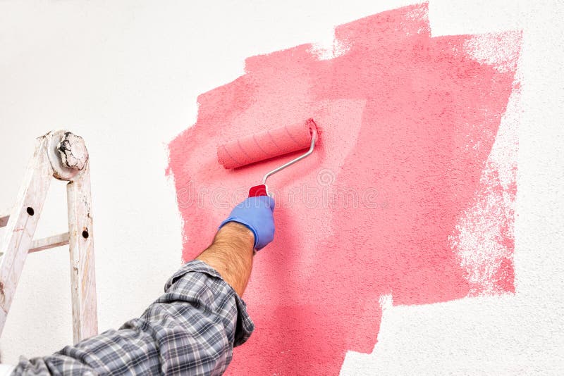 Professional House Painter at Work Painting the Wall Stock Image ...