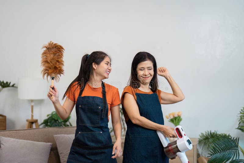 Professional Housekeeper Performing daily Cleaning Tasks in a Modern ...