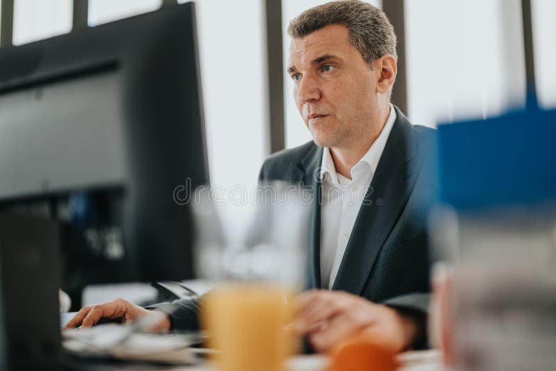 Professional Individual Focused on Computer in Modern Office ...