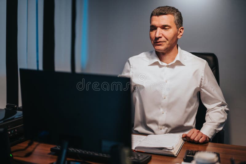 Professional Man at Desk Working with Computer in Modern Office ...