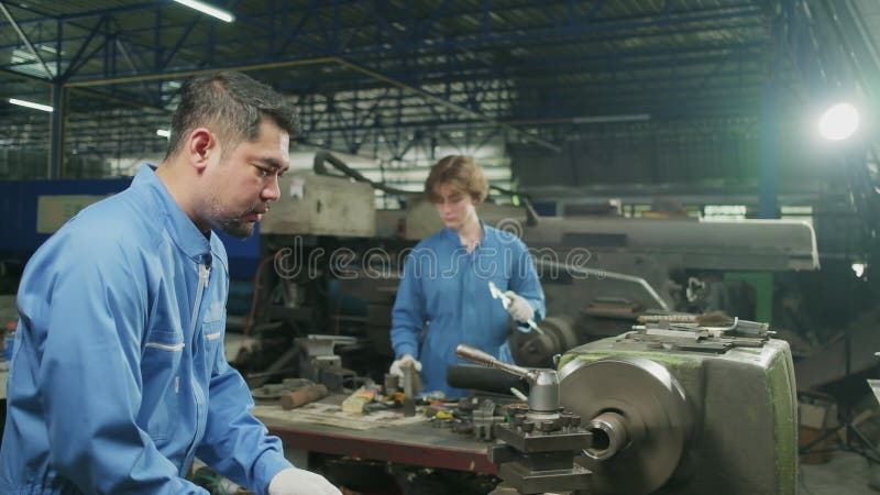 Professional Workers Teams Work in the Metalwork Manufacturing Factory ...