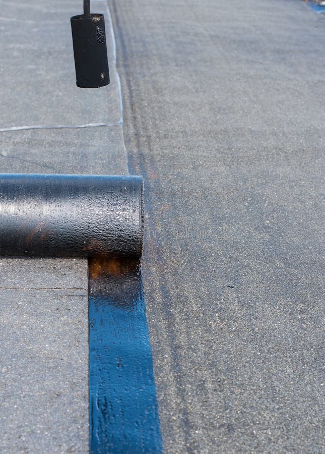 Workers Waterproofing Flat Concrete Roof Using Blowtorch And Bituminous ...