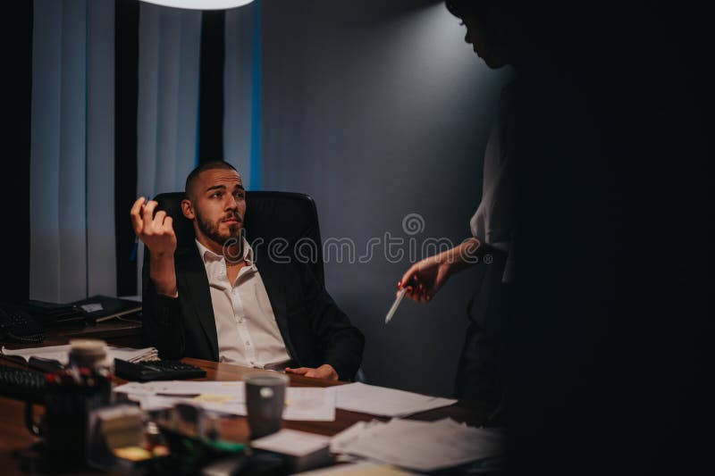 Professional Interaction between Colleagues Working Late in a Modern ...