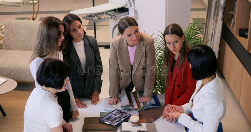Interior Designers Reviewing Fabric Swatches, Color Schemes on Tablet ...