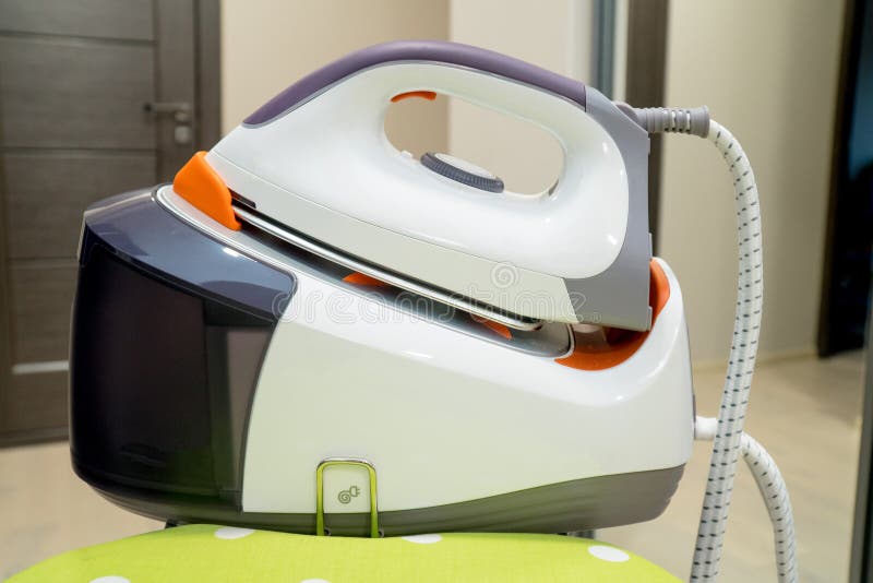 Iron with Steam. Professional Iron Using in a Tailor Shop Stock Image ...