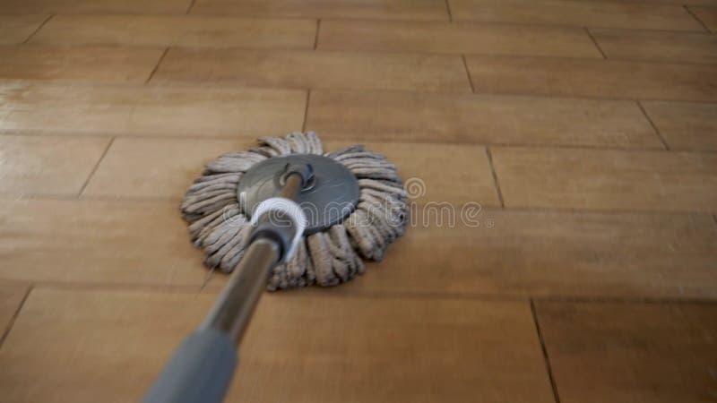 Professional Janitor Mopping Tiled Floor with Spinning Microfiber Tool ...