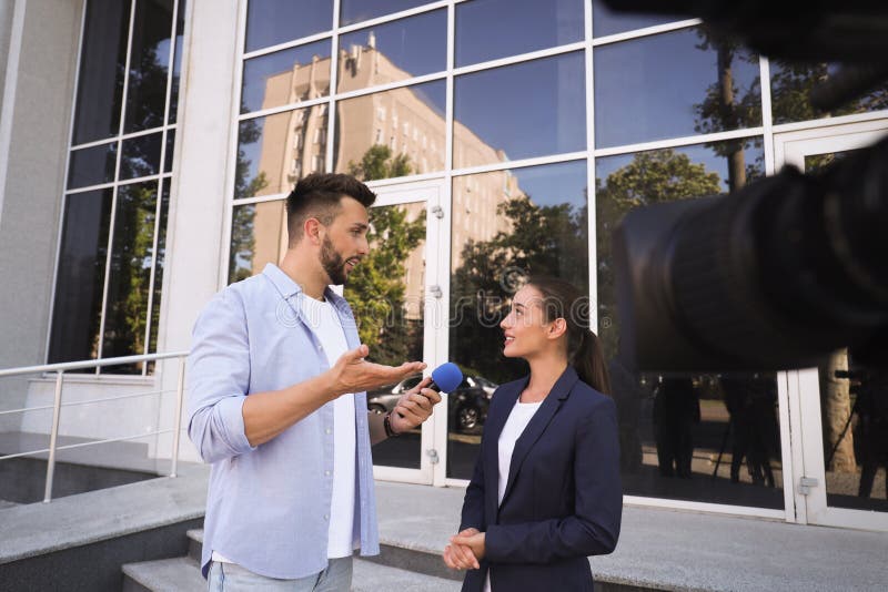 Professional Journalist Taking Interview in Front of Video Camera ...