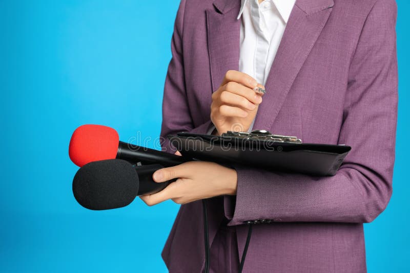 Professional Journalist Taking Notes on Blue Background, Closeup Stock ...